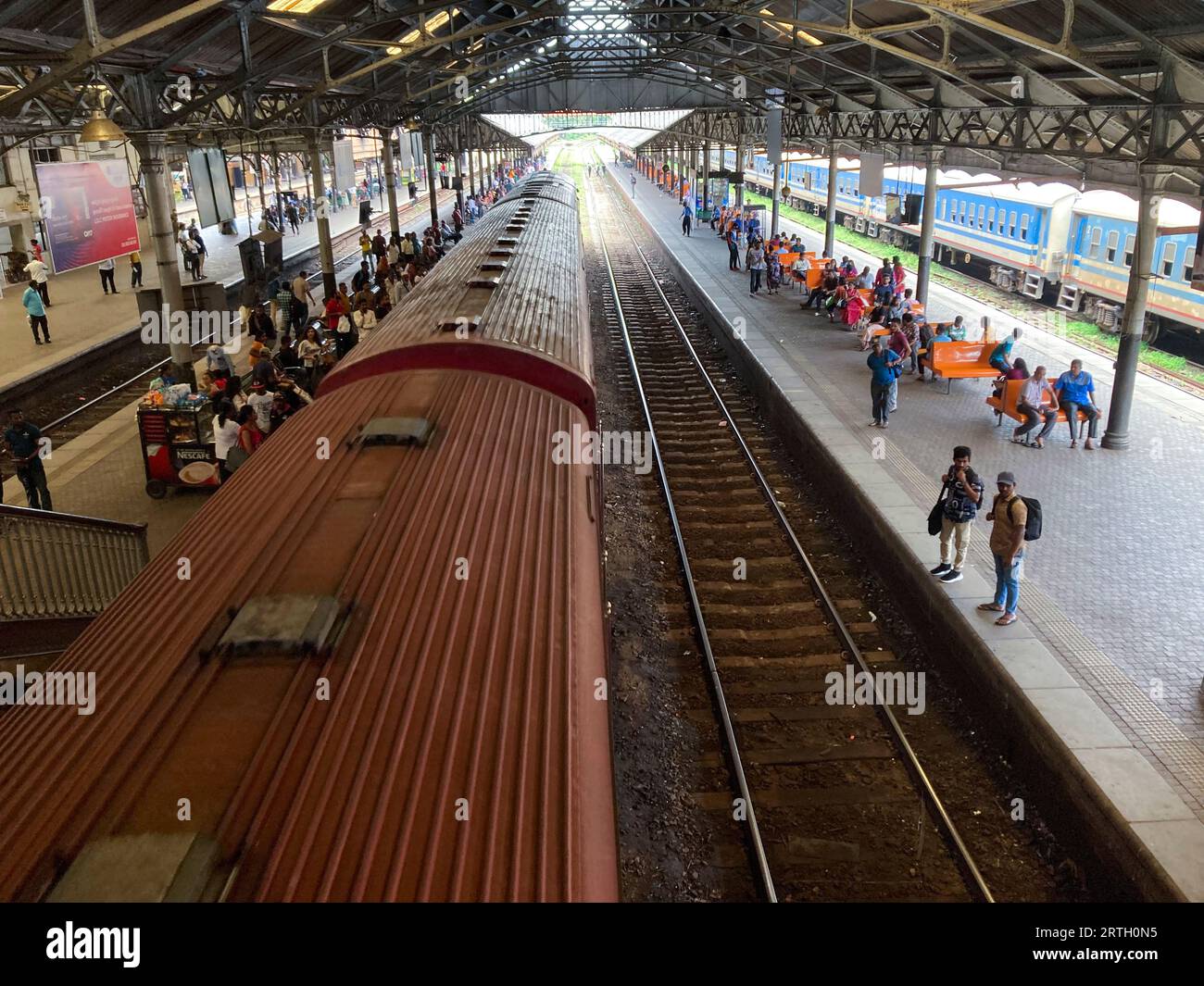 Commuters wait on a platform at the Fort railway station during a trade ...