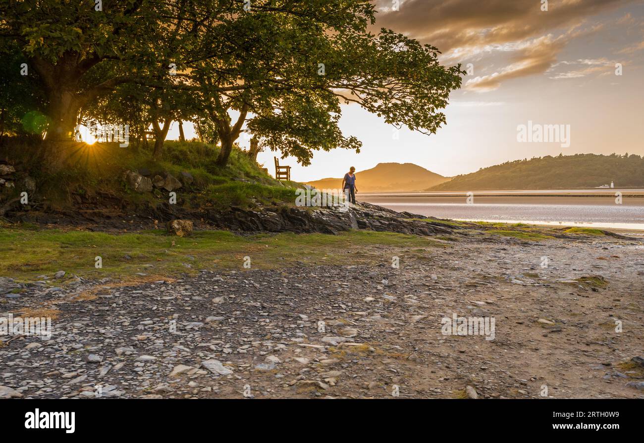 Sunset at Traeth Bach with blue sky and calm sea Stock Photo - Alamy