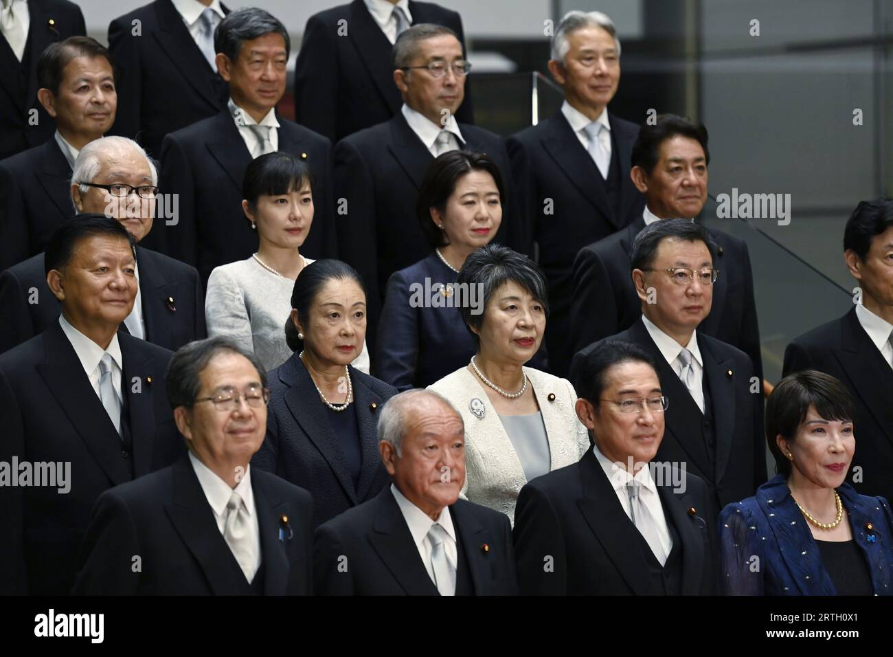 Japanese Prime Minister Fumio Kishida, second right, bottom row, poses ...