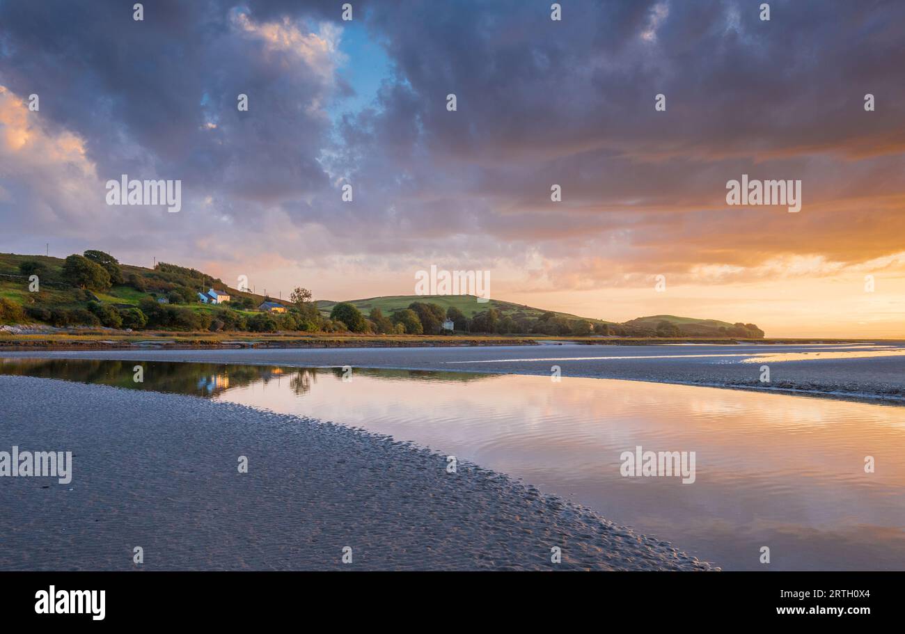 Sunset at Traeth Bach with blue sky and calm sea Stock Photo - Alamy