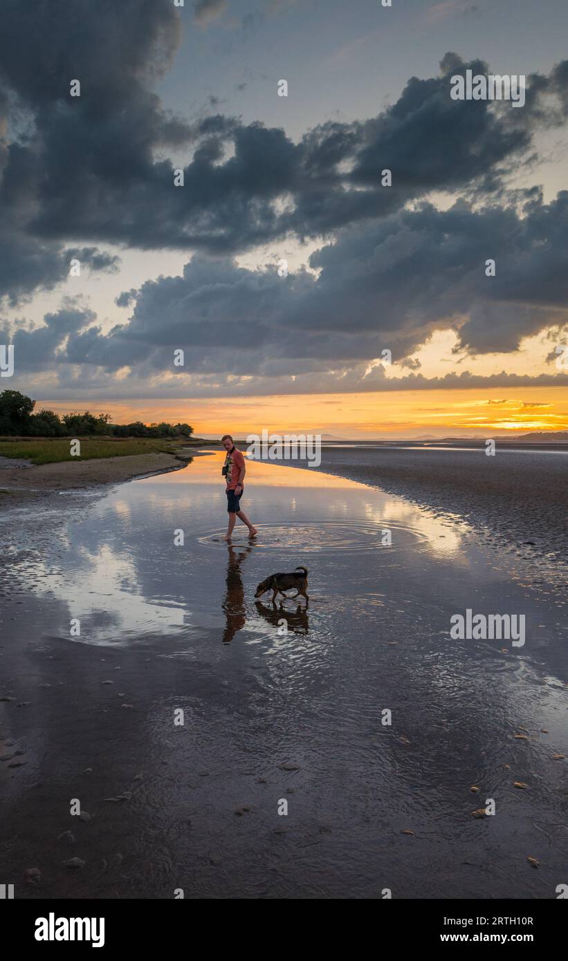 Sunset at Traeth Bach with blue sky and calm sea Stock Photo - Alamy