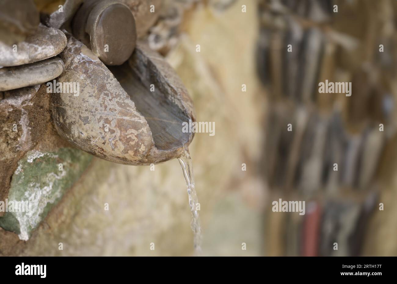 Old stone and fountain with spring water flowing into pool Stock Photo ...