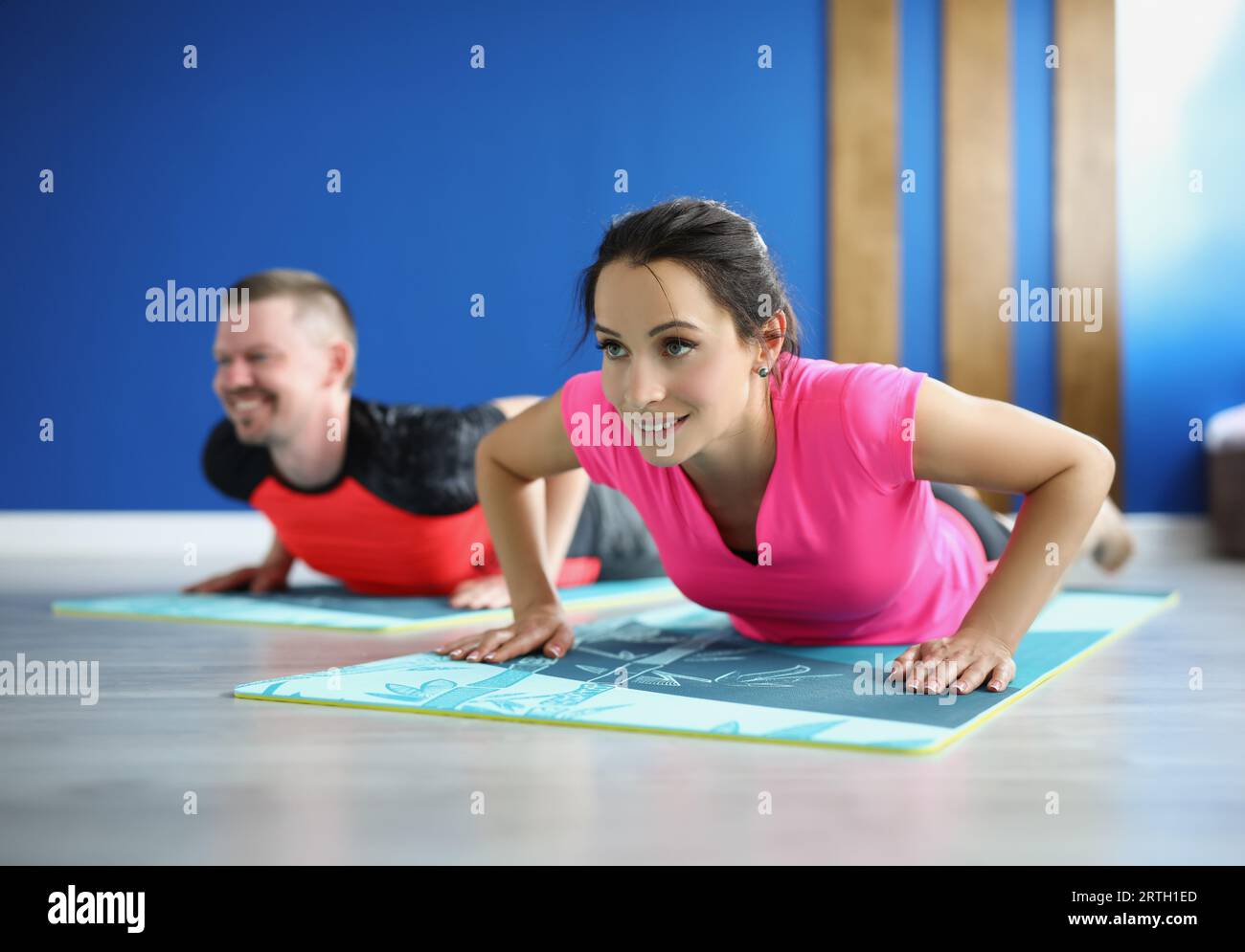 Smiling man and woman doing exercise for fit body goal, active train in ...