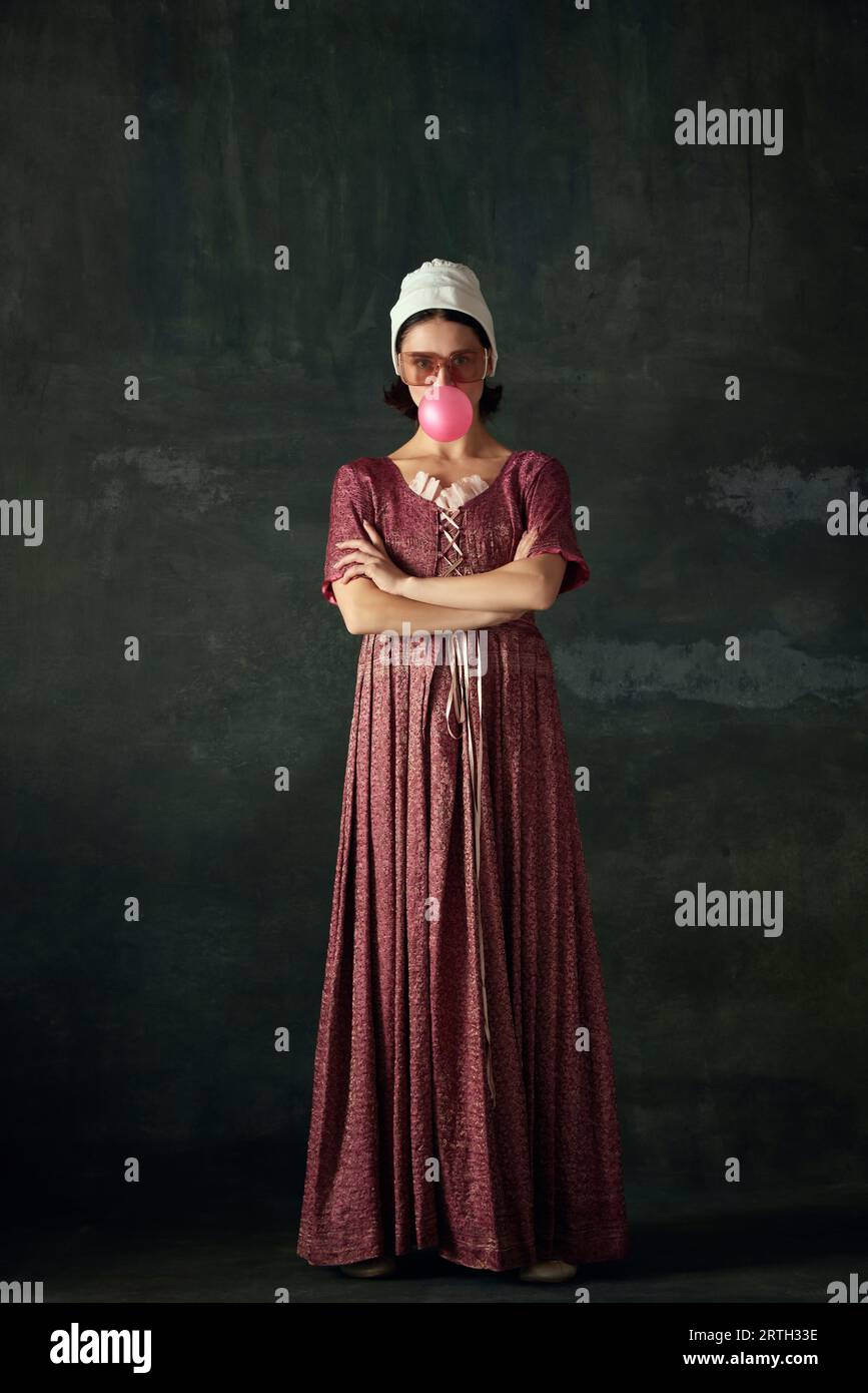 Young woman in image of medieval maid, wearing historical attire and ...
