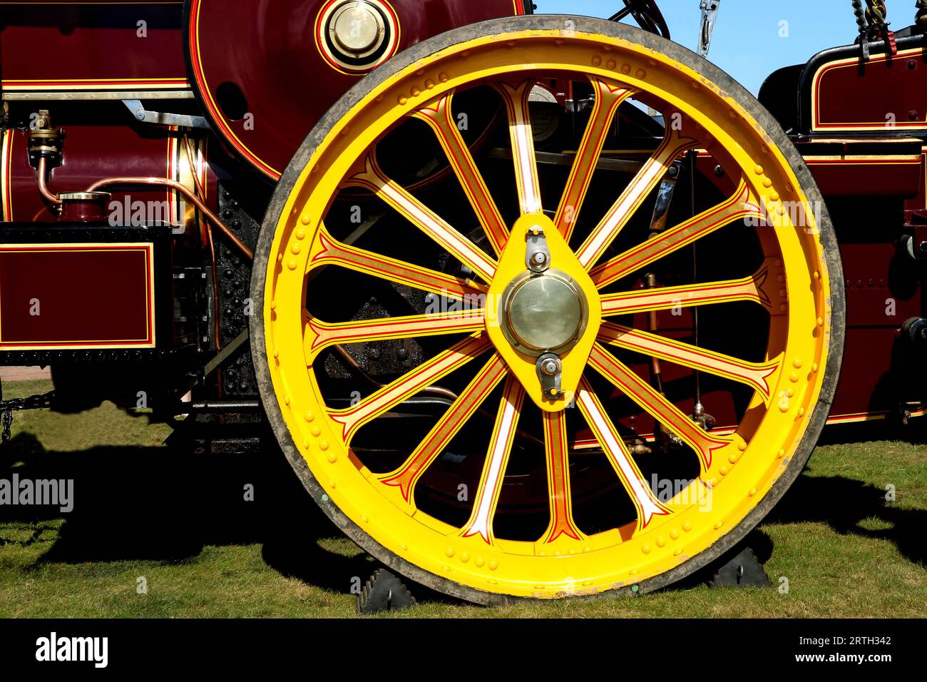 Closeup view of a vintage steam engine wheel area at a country fair ...