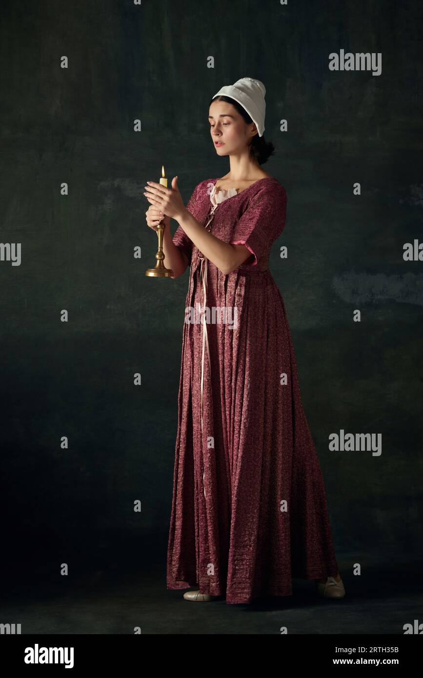 Evening aesthetics of medieval era. Tender woman, maid in historical ...