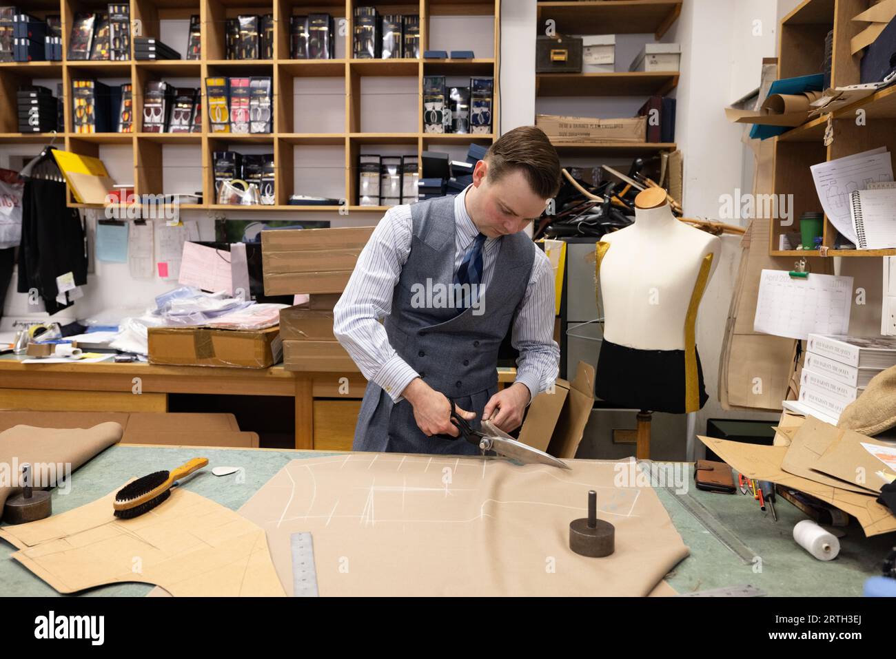 Master Cutter at Dege & Skinner, family-owned tailoring house, Savile ...