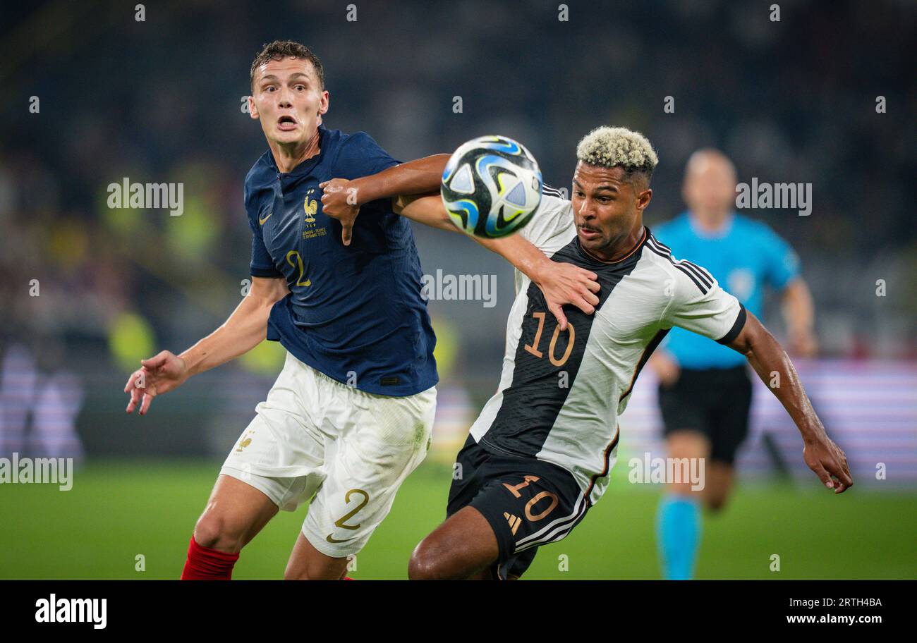 Dortmund, Germany. 12th Sep 2023. Benjamin Pavard (FRA), Serge Gnabry ...