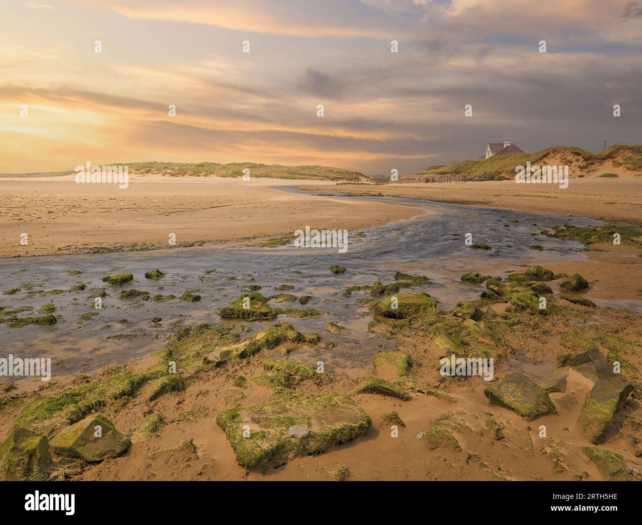 Rhosneigr is famed for its stunning sunsets. Here the sun casts a ...
