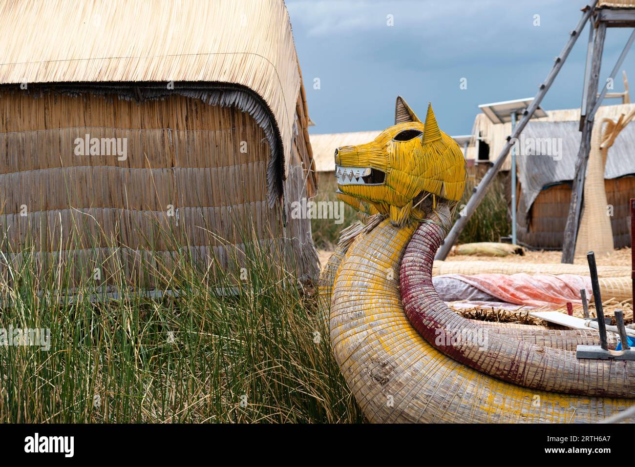 traditional reed boat moored on floating Uros Islands at Lake Titicaca ...