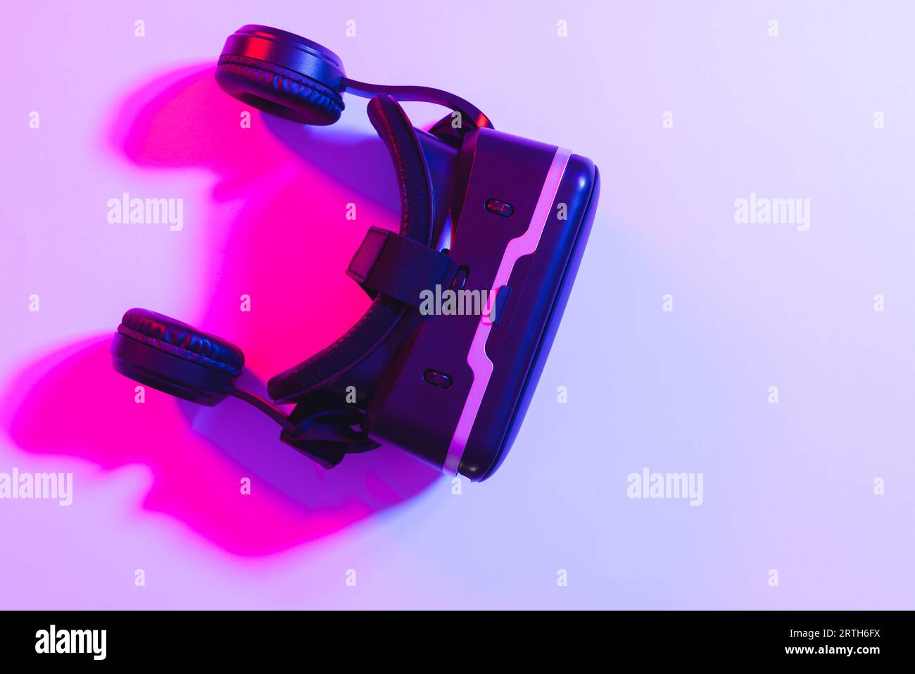 Composite of vr headset with copy space on neon background Stock Photo ...