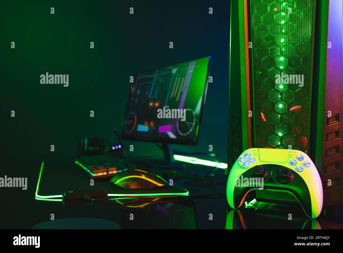 Composite of computer with video game accessories with copy space on ...