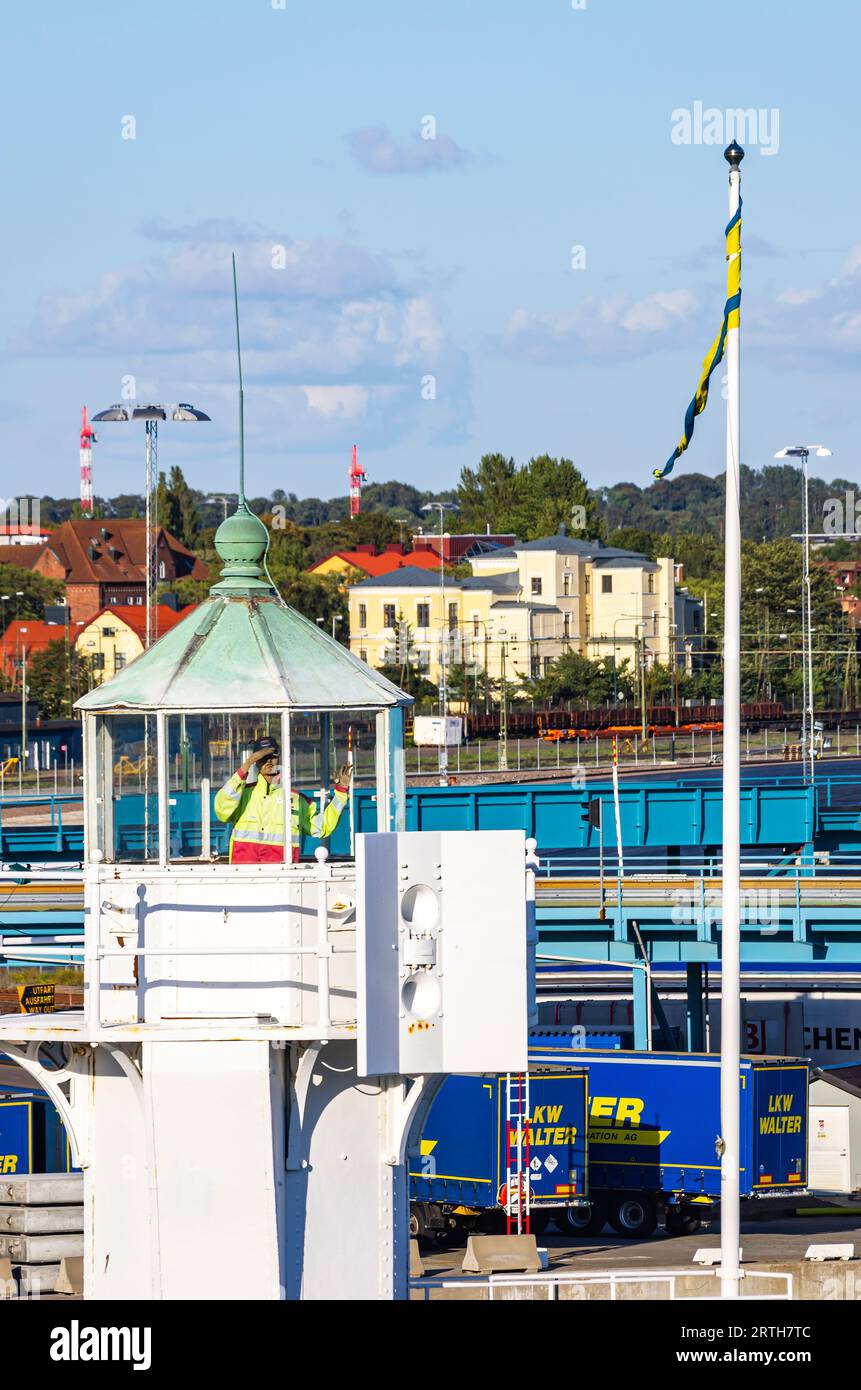 Swedish humour, a mannequin in a dockworker's work clothes keeps a ...