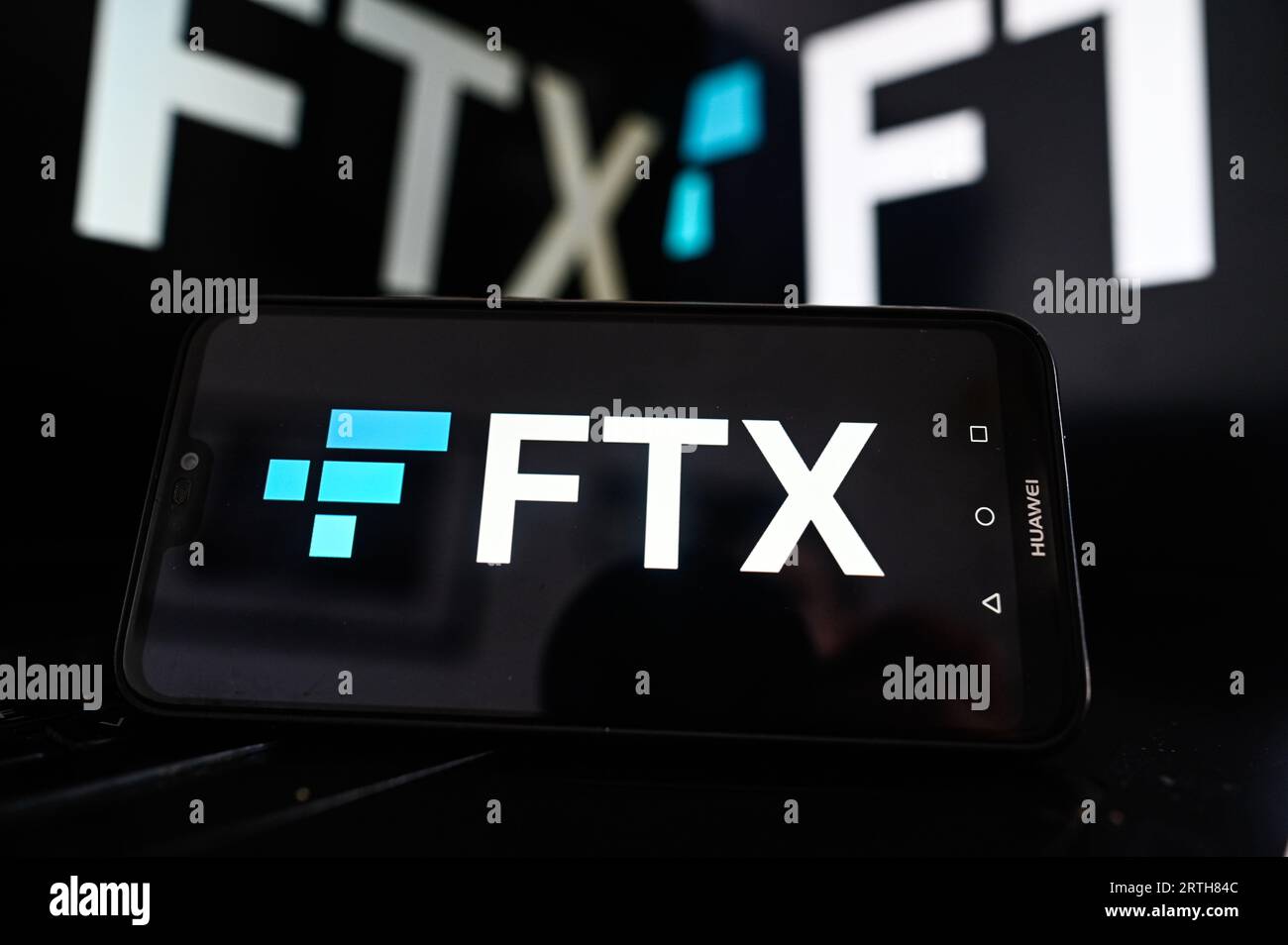 In this photo illustration a FTX logo is displayed on a smartphone and ...