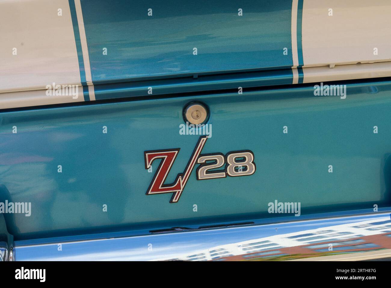 Close-up shot of a blue Chevrolet vehicle featuring the Z28 logo ...