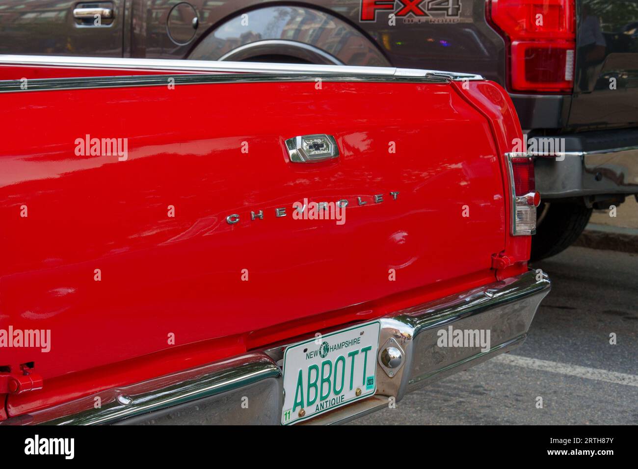 Closeup of the Chevrolet logo on a vibrant red sports car Stock Photo ...