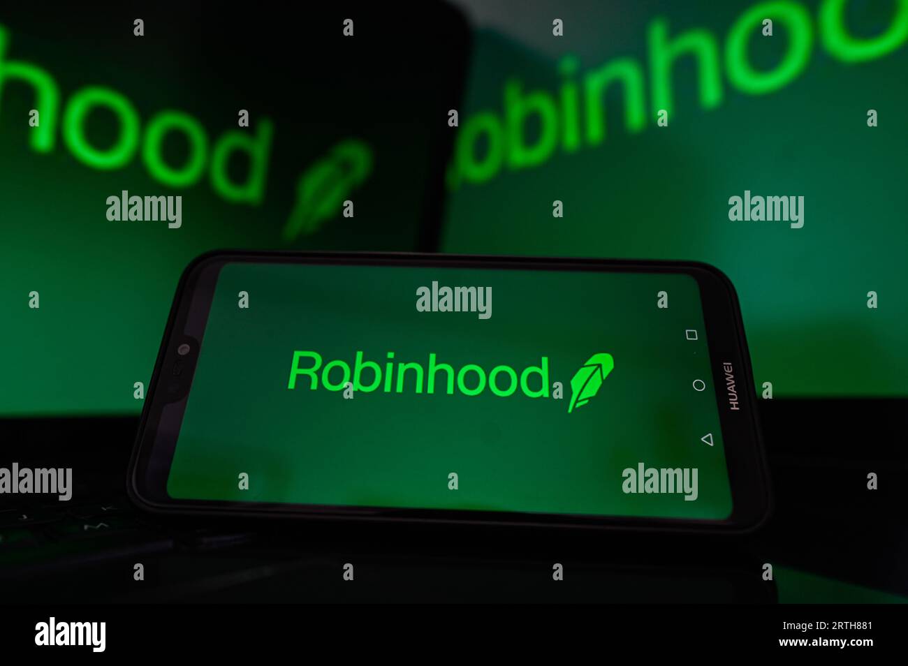 In this photo illustration a RobinHood logo is displayed on a ...