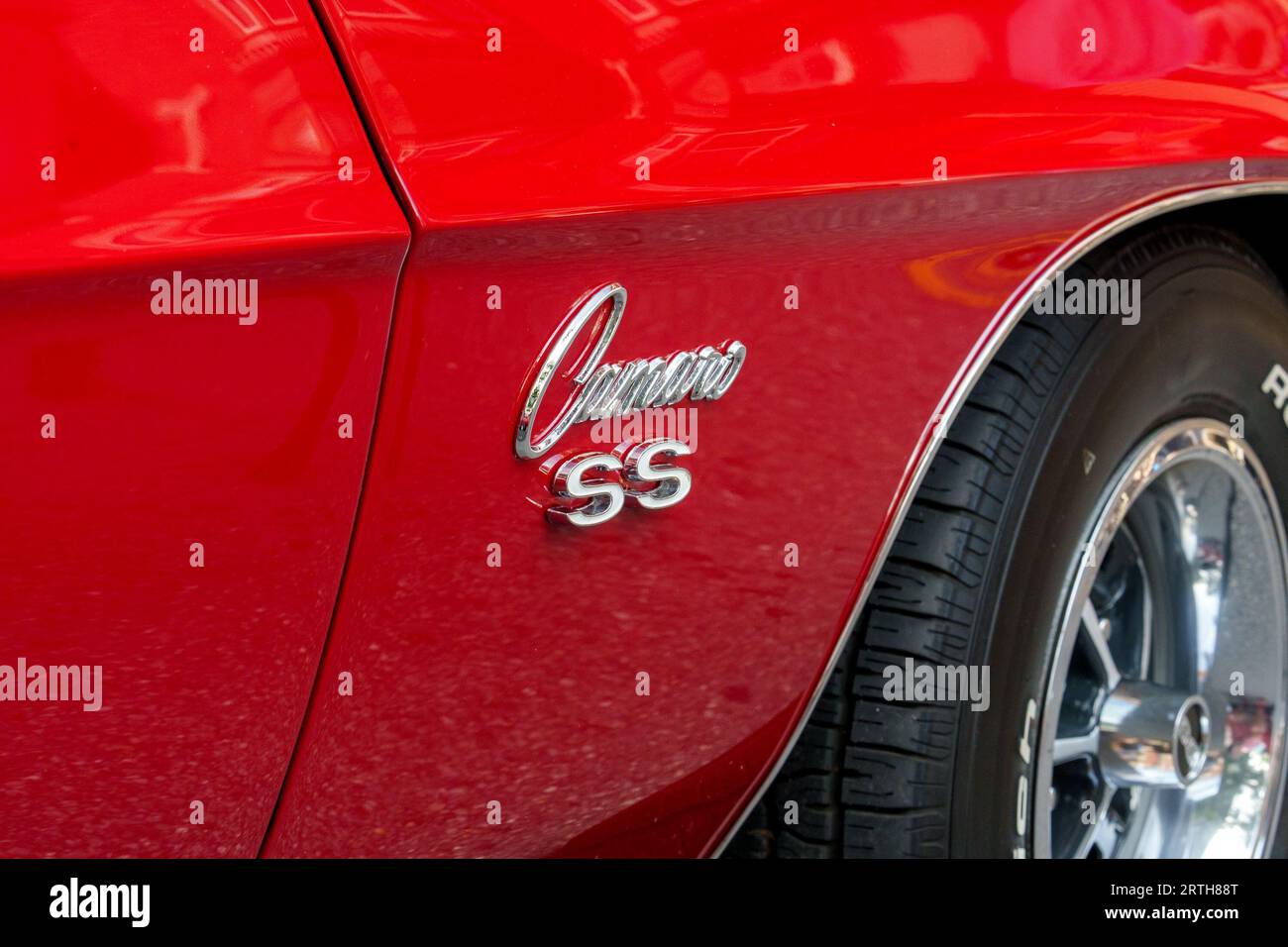 A closeup of the badge of a Chevrolet Camaro SS car in an eye-catching ...
