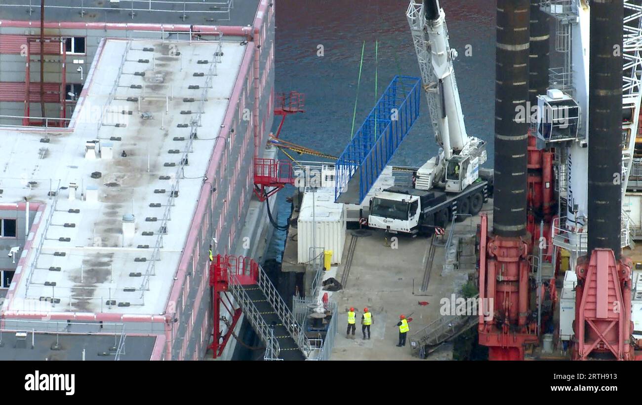 Screen grab taken from PA Video of a new gangway ramp being moved into ...
