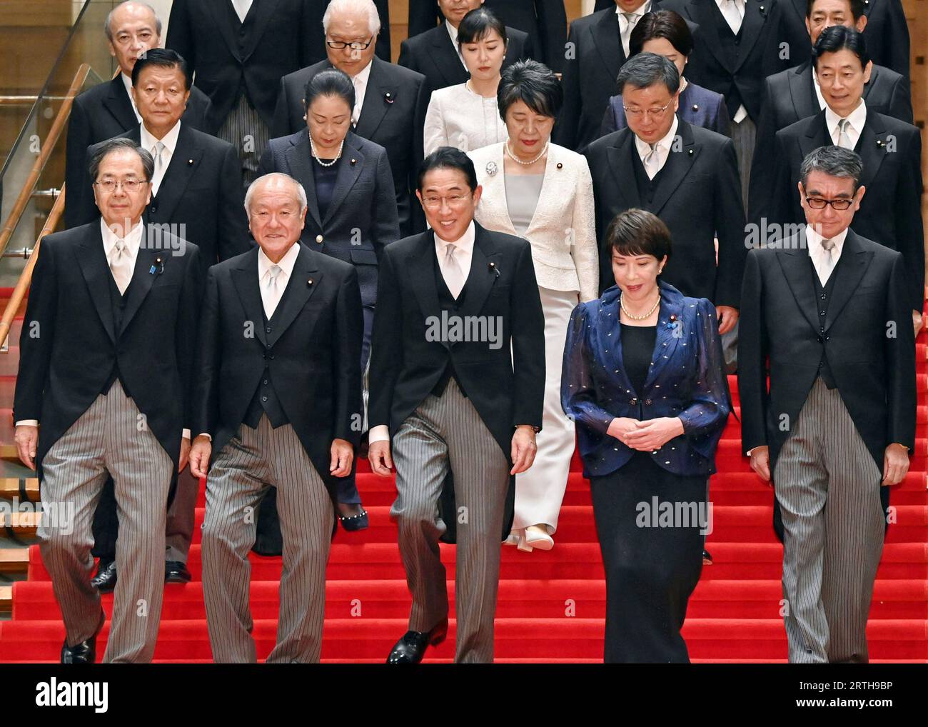 Japanese Prime Minister Fumio Kishida (front,C) and his Cabinet ministers pose for a photo ...