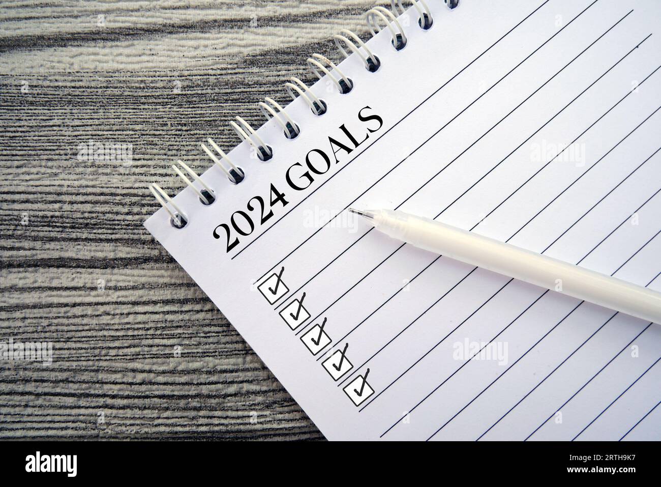 New year resolutions 2024. 2024 goals list with notebook on wooden ...