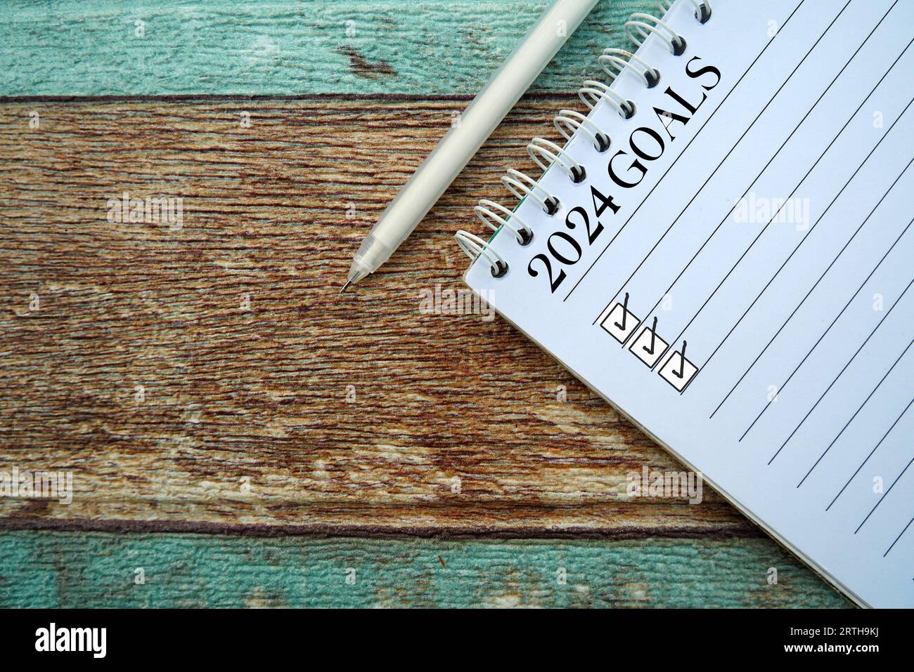 New year resolutions 2024. 2024 goals list with notebook on wooden ...