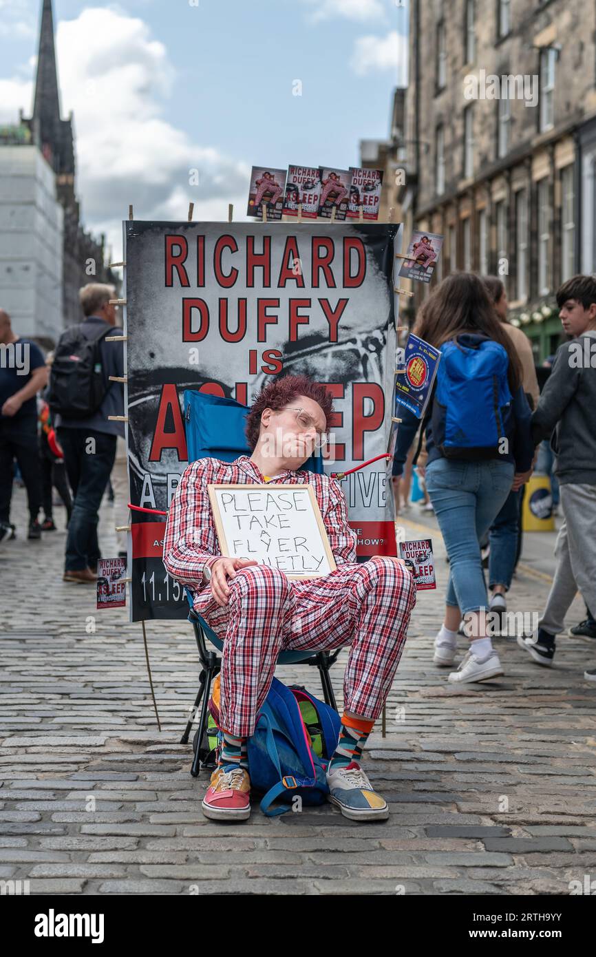Edinburgh Festival Fringe performer handing out advertising leaflets ...