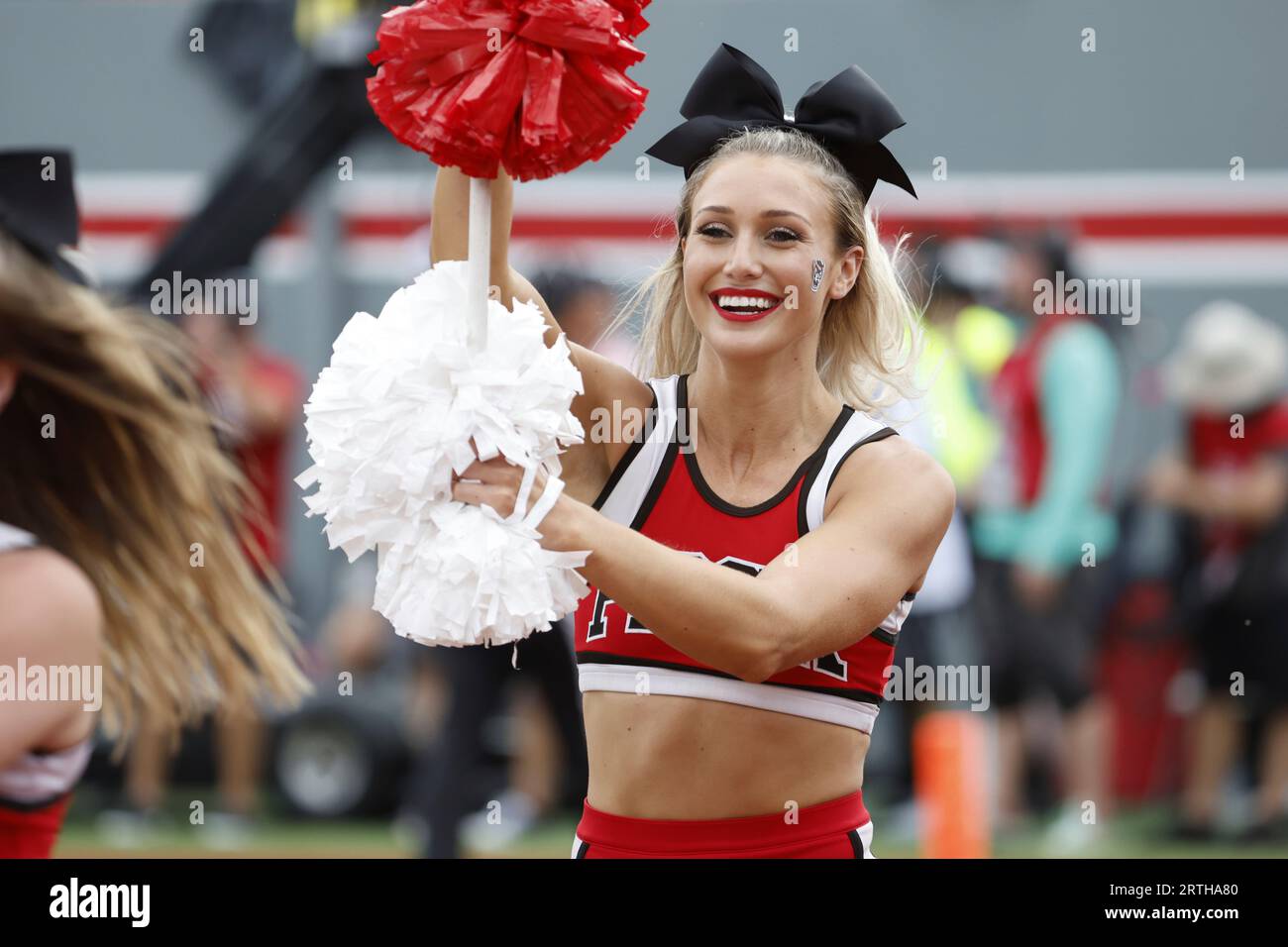 North Carolina State cheerleader Madi Walker celebrates a touchdown by ...