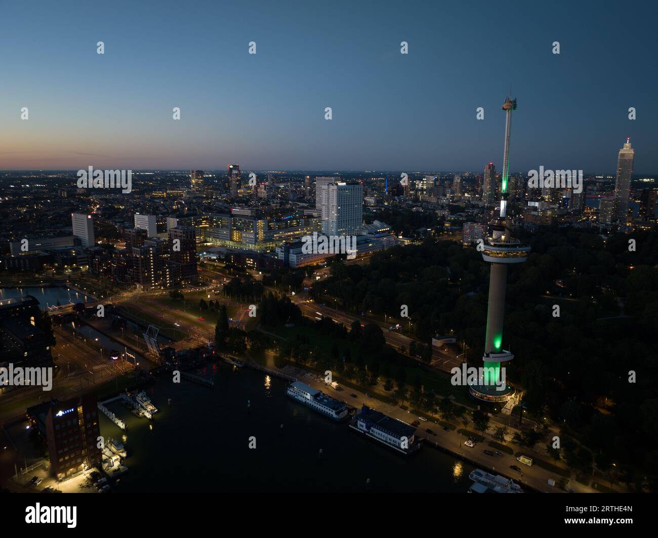 Aerial drone view of skyline of Rotterdam at dusk, night. Euromast ...
