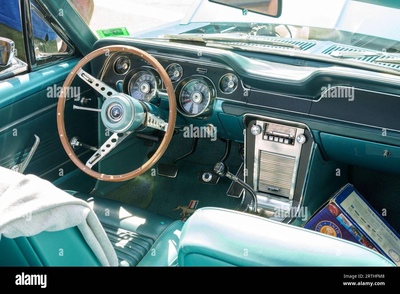 An interior view of a classic Ford Mustang car, with the dashboard and ...