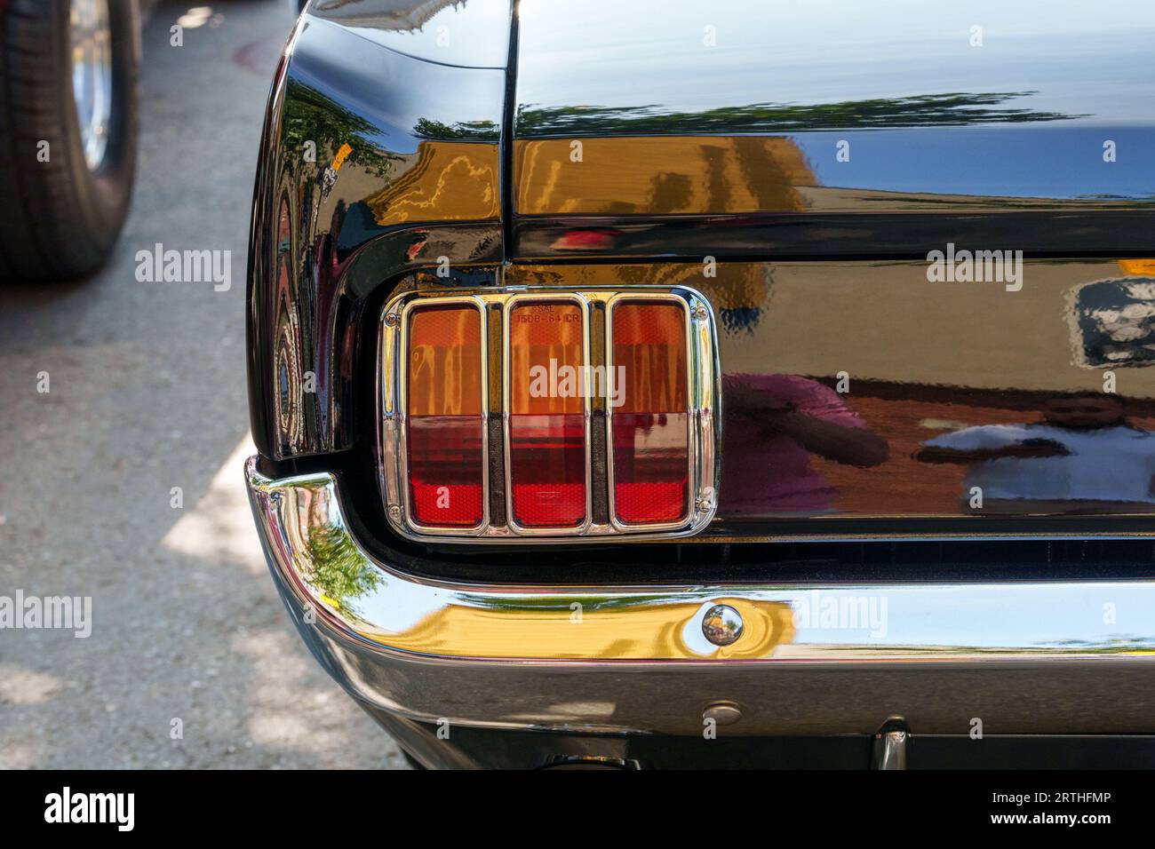 A sleek black Ford Mustang sports car parked on the street in ...