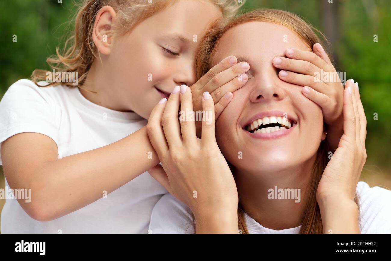 mother and daughter hugging in love playing in the park Stock Photo - Alamy