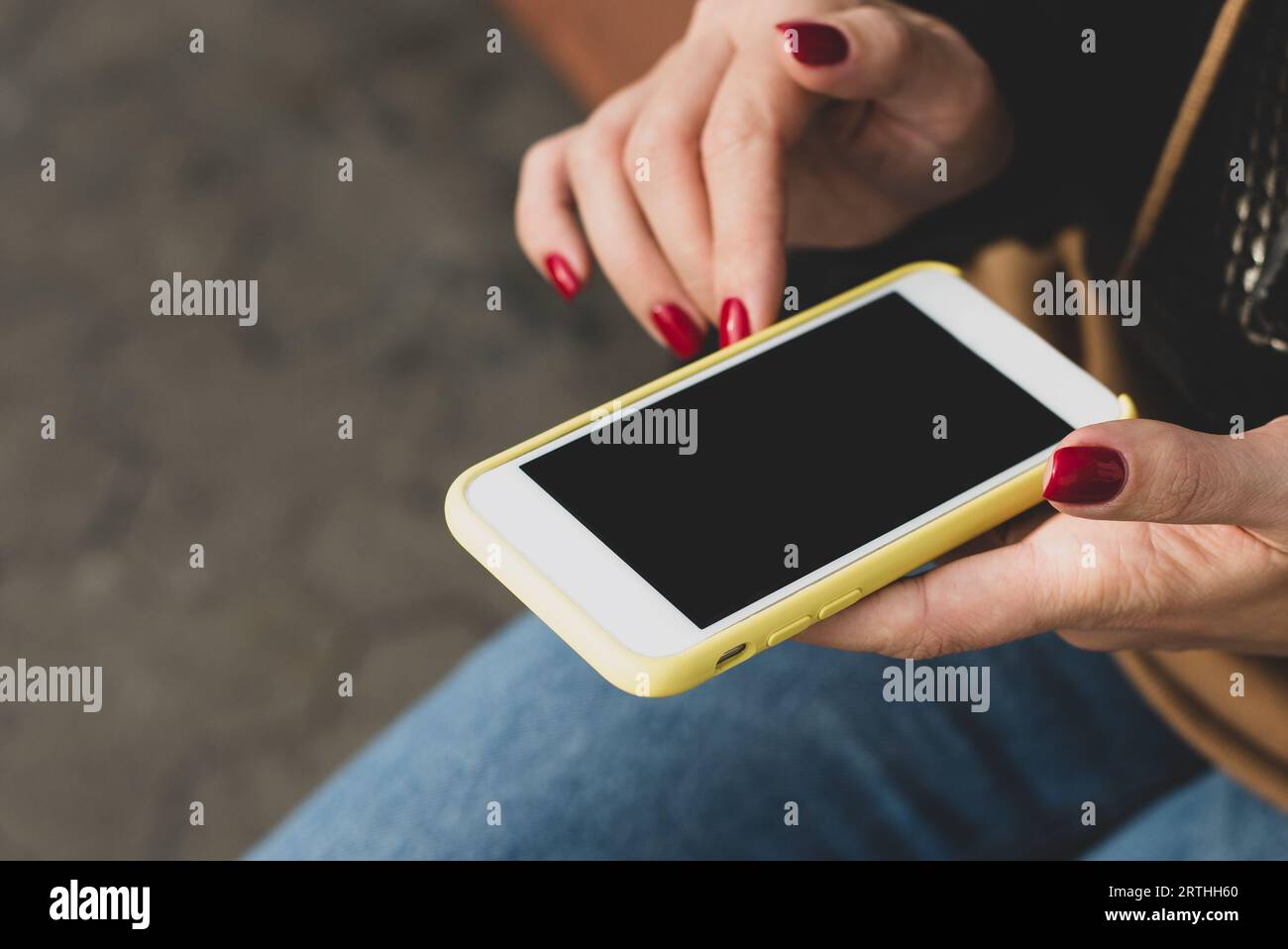 Woman uses smartphone touch screen hi-res stock photography and images ...