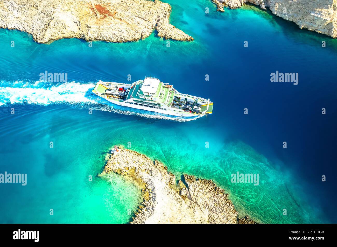 Rab island ferry boat in narrow stone desert passage aerial view ...