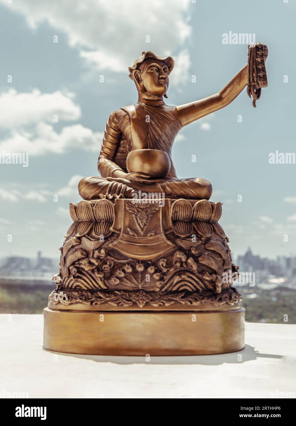 Bronze figurine of Phra upagupta or Phra bua khem statue with nature ...