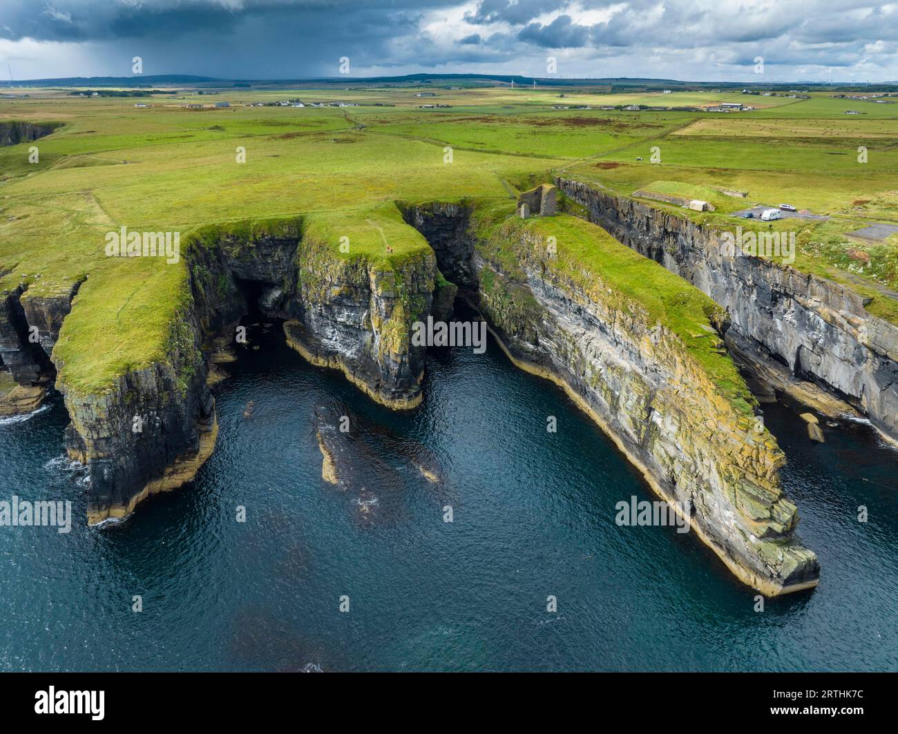 Aerial view of the ruined Castle of Old Wick surrounded by rugged ...