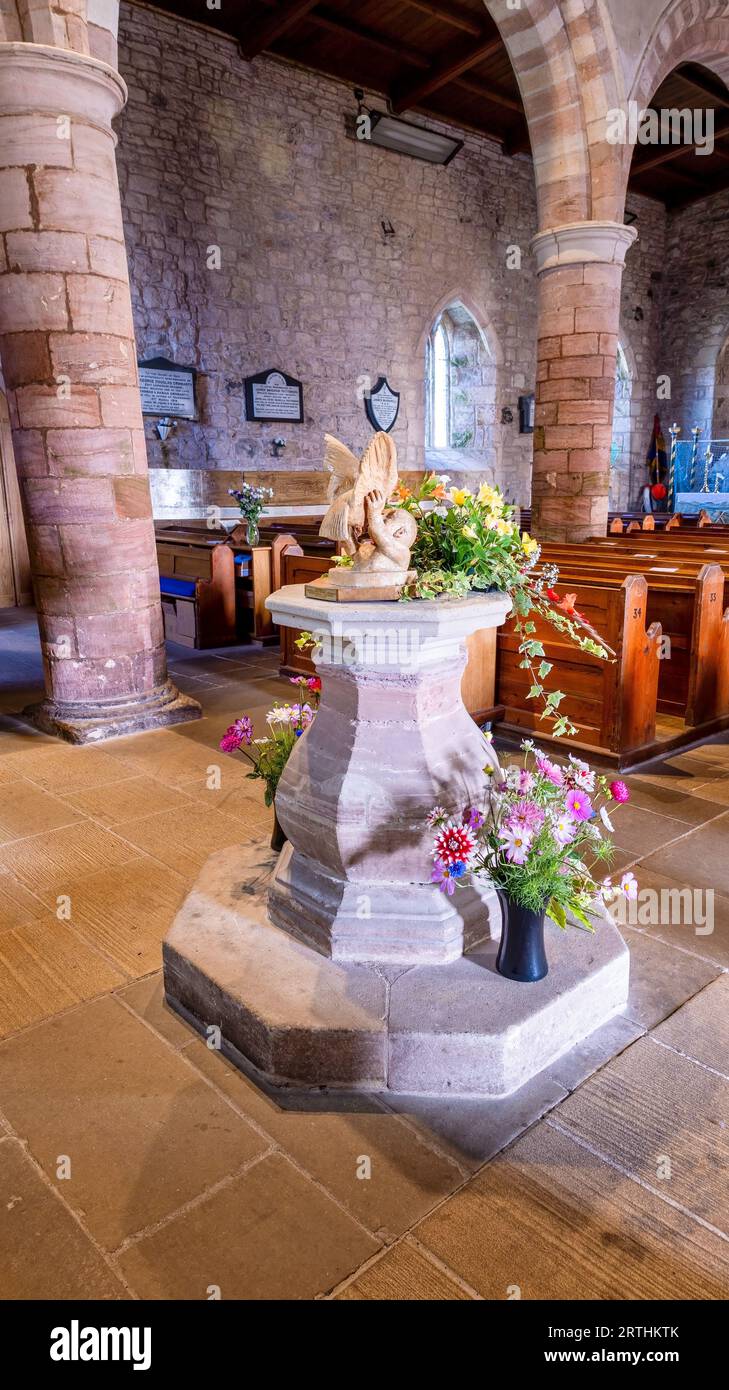 Statue of a mans holding a bird on a pedestal in St Mary's Church, Holy ...