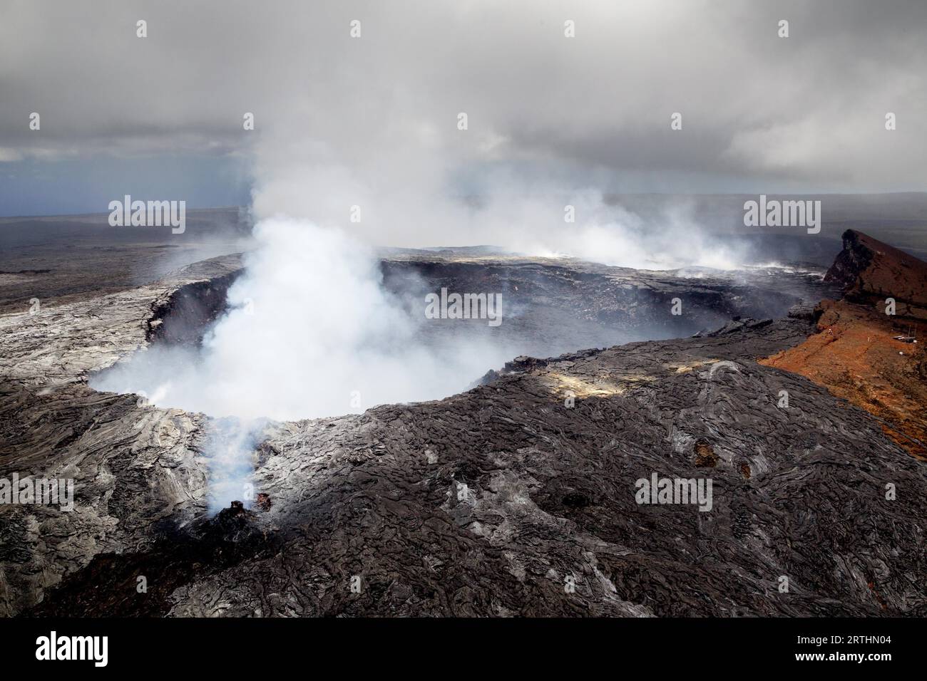 Aerial view of the smoking Halemaumau crater on Kilauea, an active ...