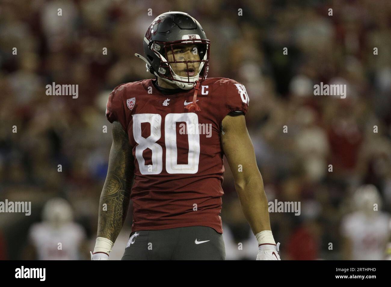Washington State defensive end Brennan Jackson stands on the field ...