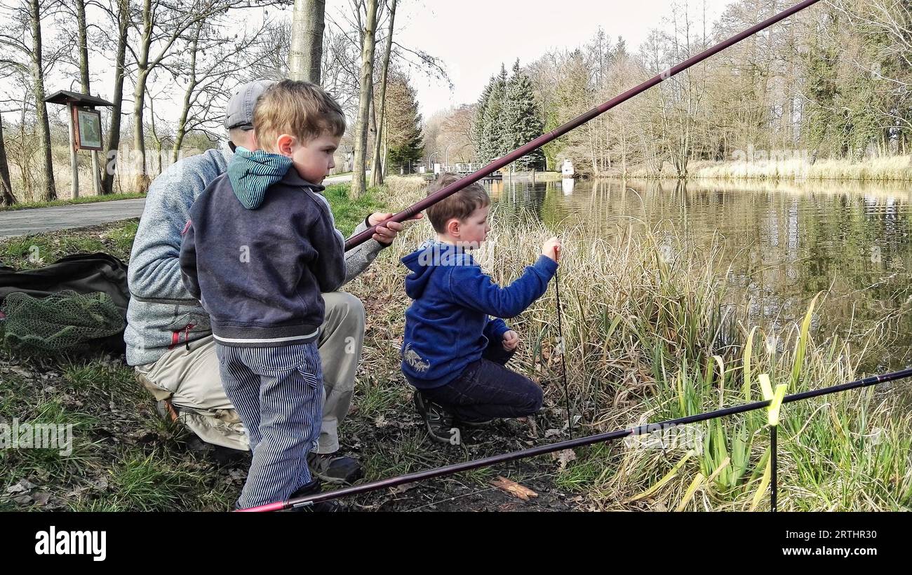 Fishing with the offspring Stock Photo - Alamy