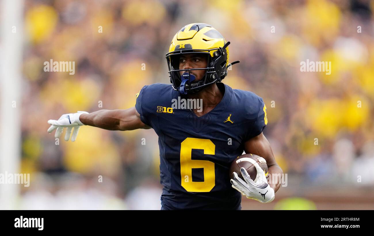 Michigan wide receiver Cornelius Johnson (6) runs after a catch against ...