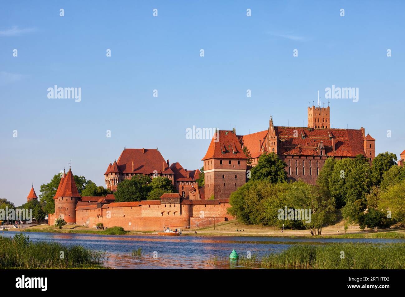 Malbork Castle at Nogat River in Poland, medieval landmark Stock Photo ...