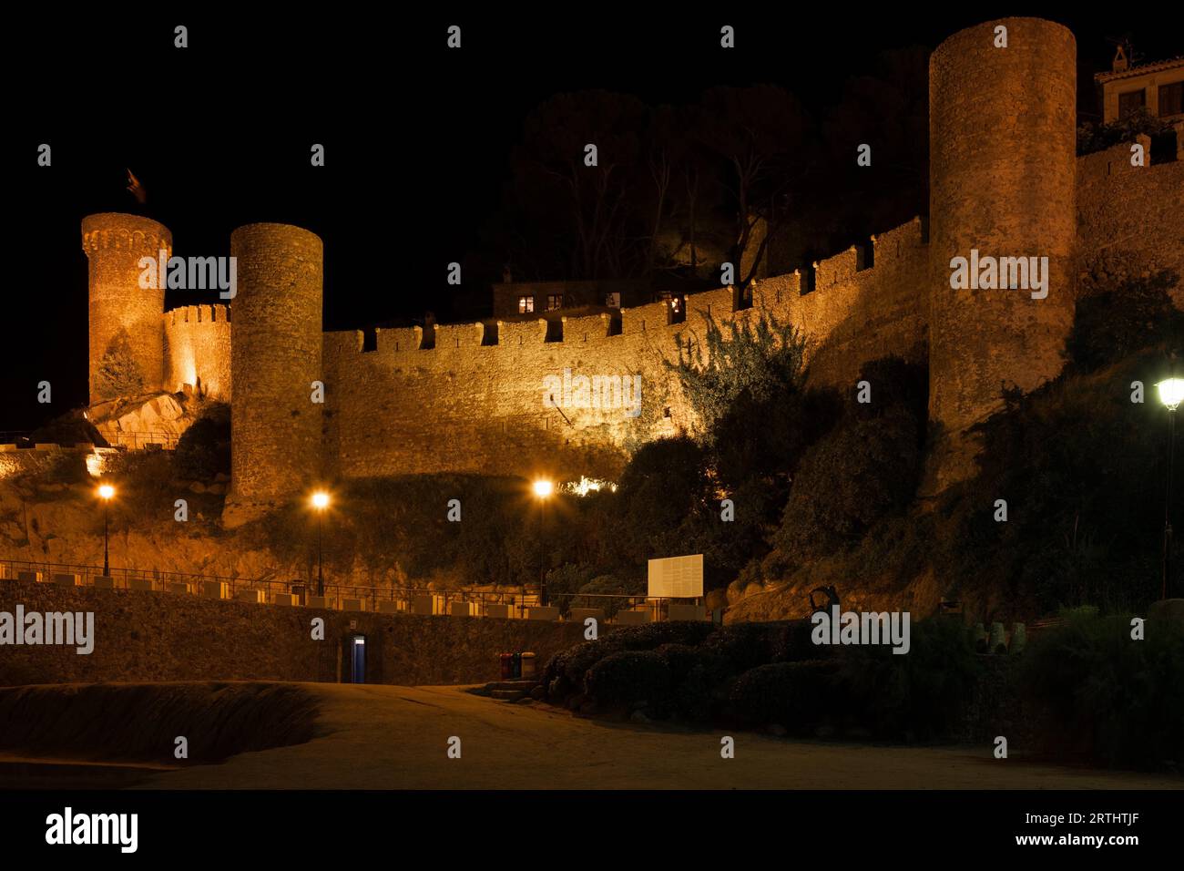 Spain, Costa Brava, Tossa de Mar at night, castle, stone wall of the ...