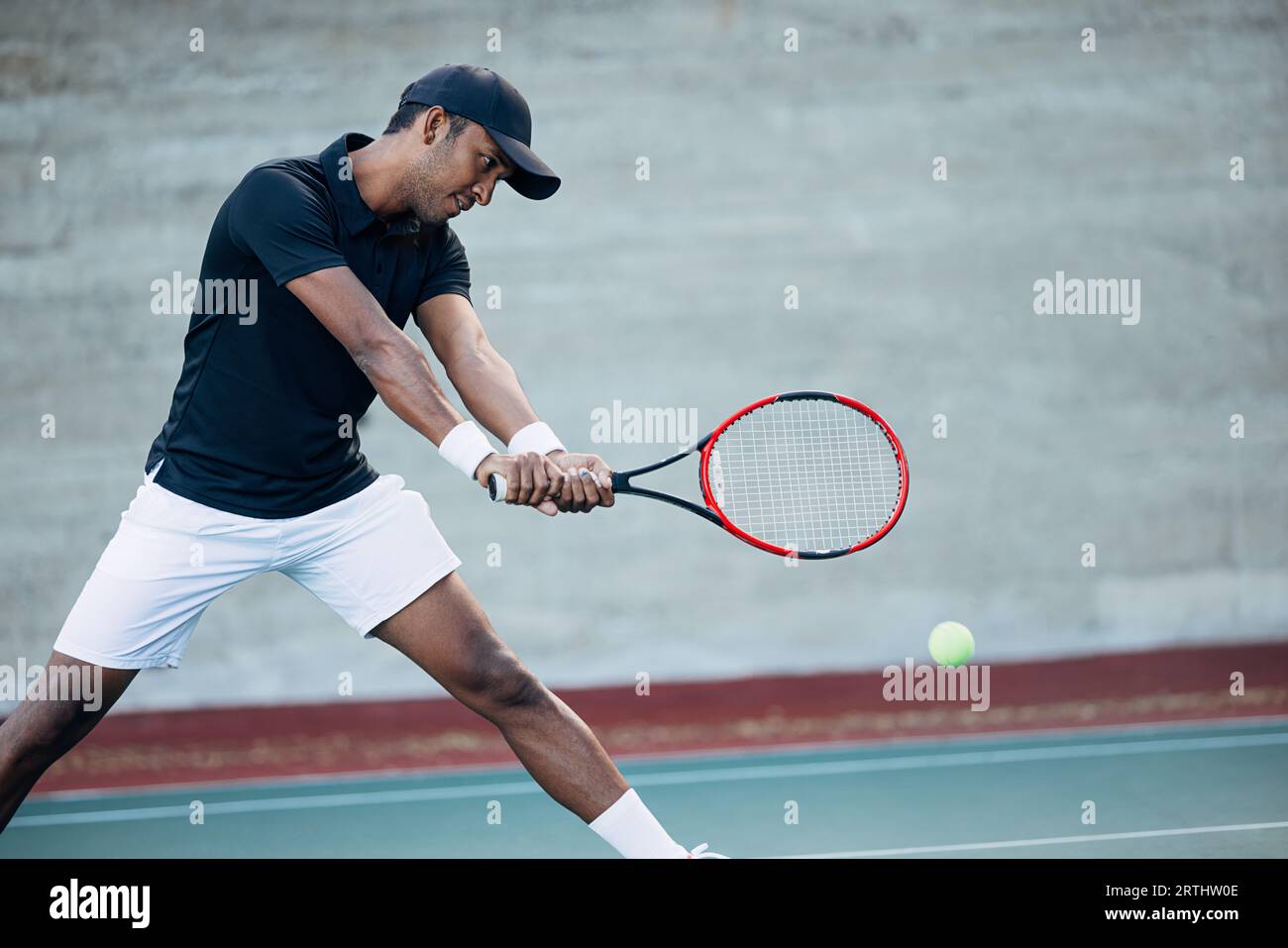 Tennis player receiving the serve. Professional tennis player hitting a ...