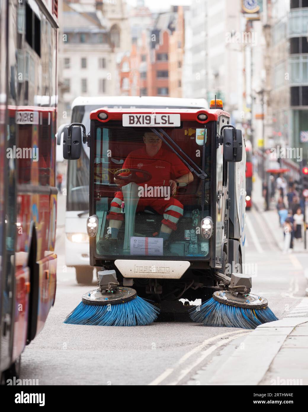 A Boschung electric street sweeper vehicle cleans the road on Ludgate ...