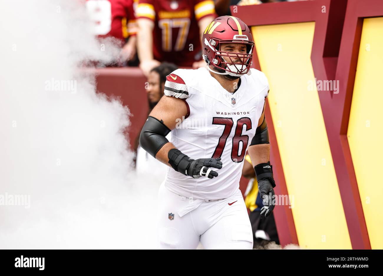 Washington Commanders T Sam Cosmi (76) taking the field during pregame ...