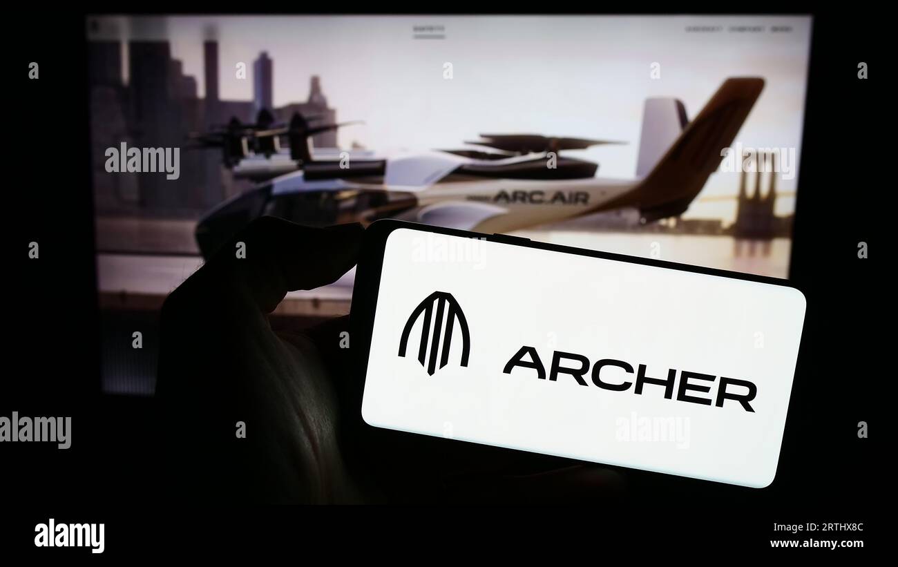 Person holding smartphone with logo of US eVTOL aircraft company Archer ...