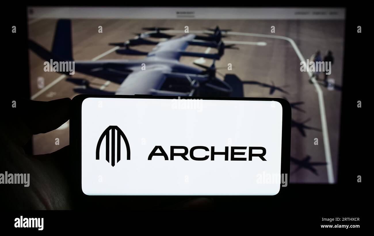 Person holding cellphone with logo of American eVTOL aircraft company ...