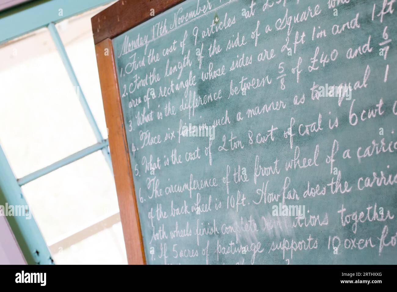 A vintage blackboard with writing in a school classroom Stock Photo - Alamy