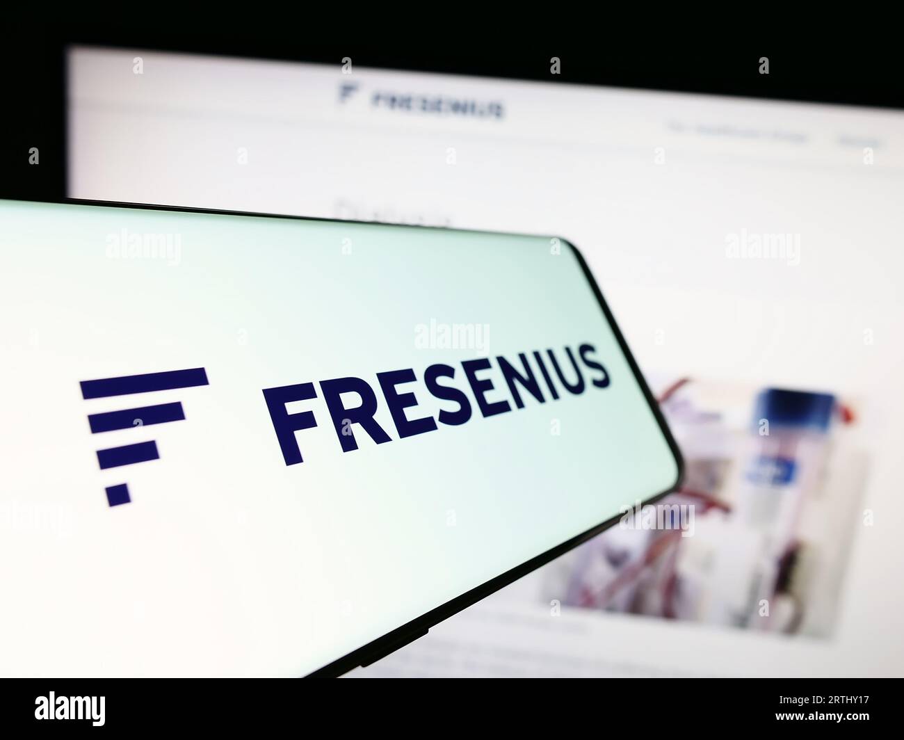 Smartphone with logo of German healthcare company Fresenius SE Co. KGaA ...